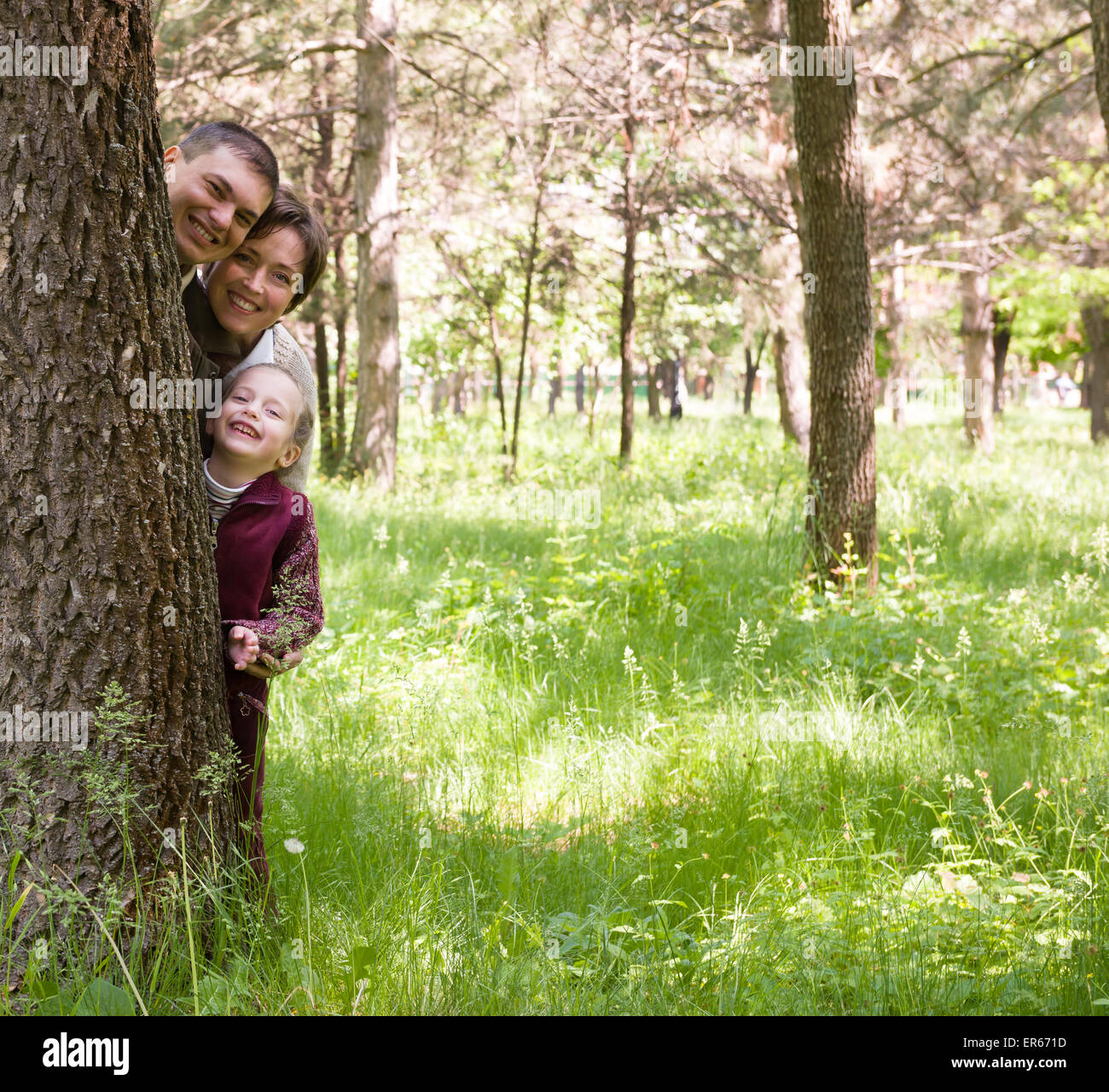 Family in the park at spring Stock Photo - Alamy