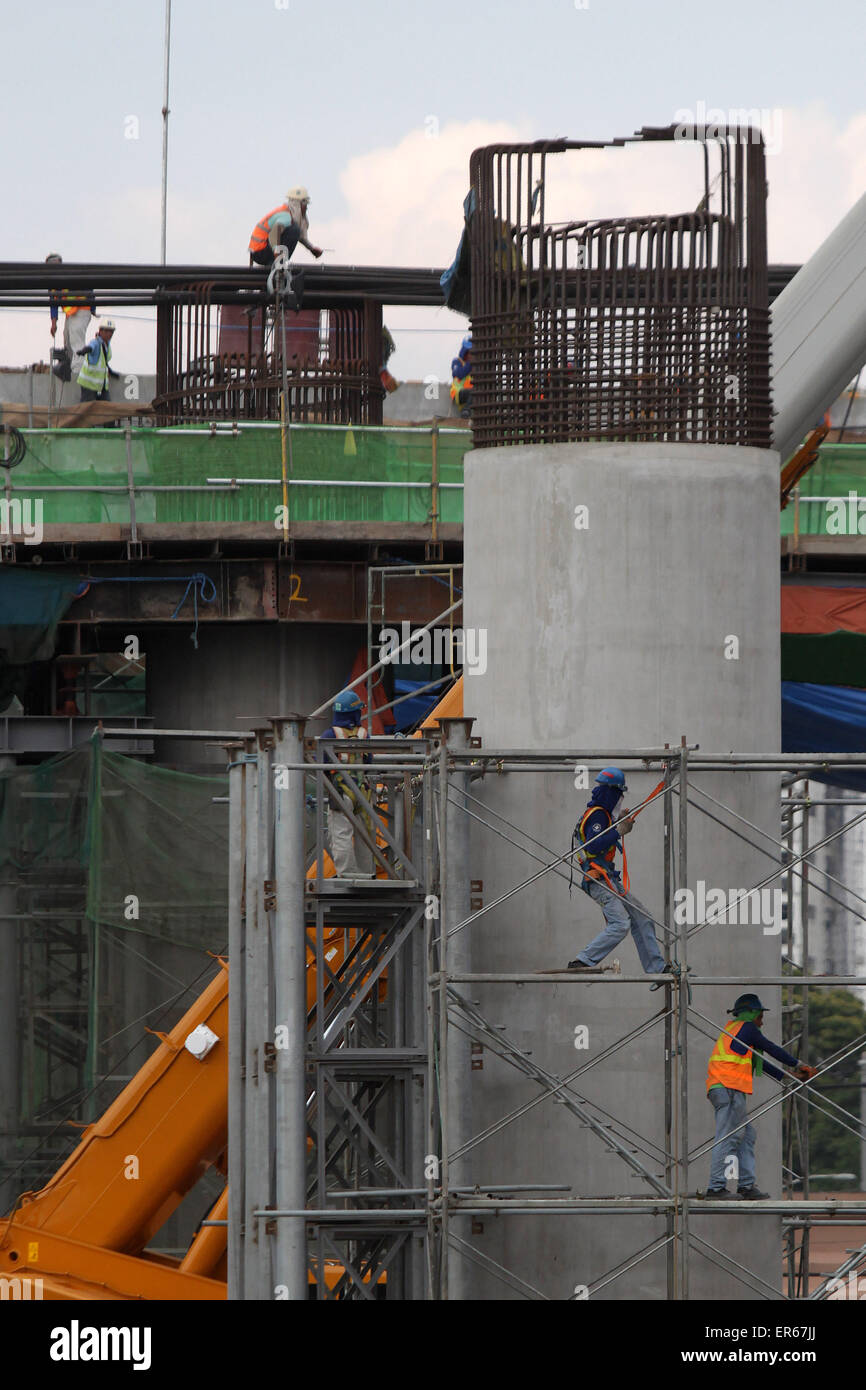 Paranaque City, Philippines. 28th May, 2015. Laborers work at a ...