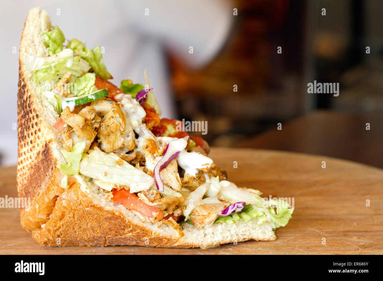 Kebab grilled meat in bread in restaurant closeup Stock Photo - Alamy