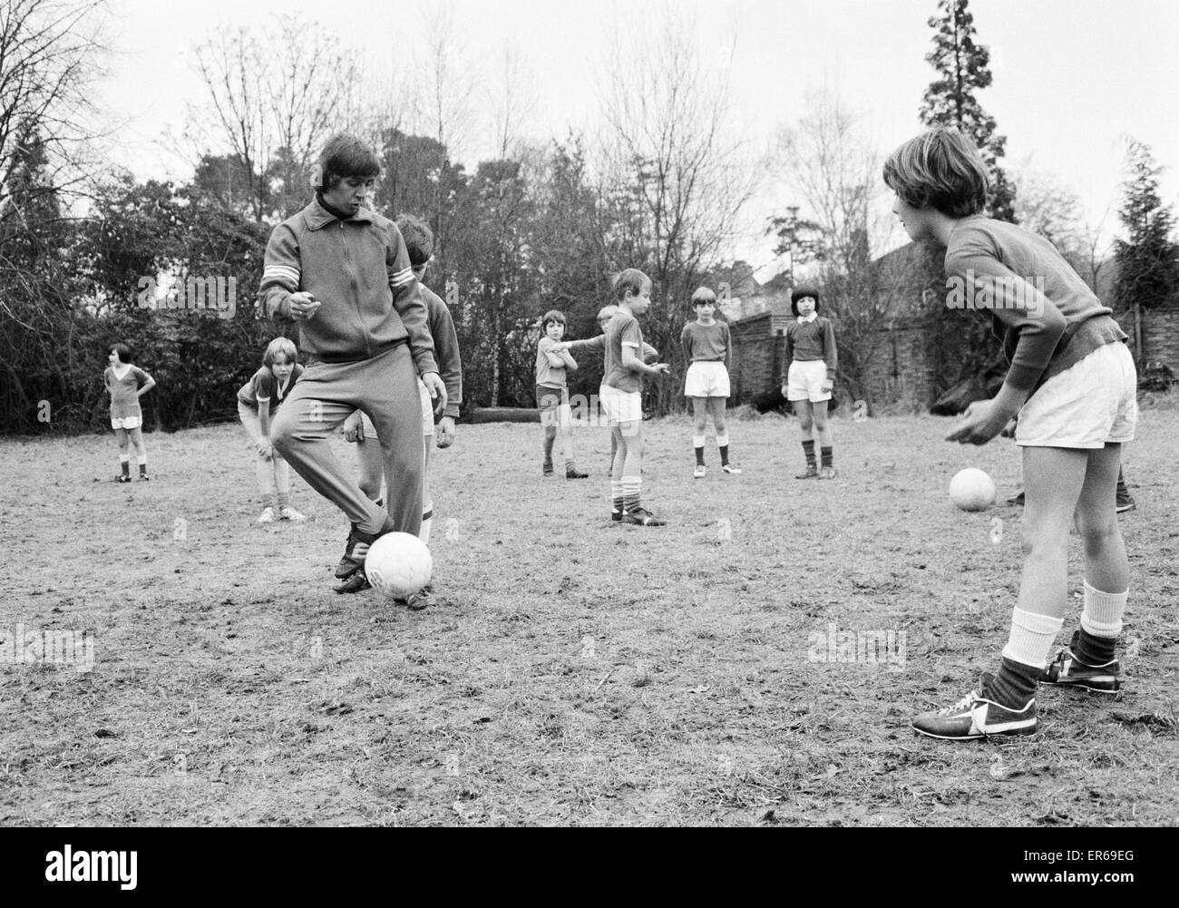 Queens Park Rangers footballer Don Masson coaching children to play ...
