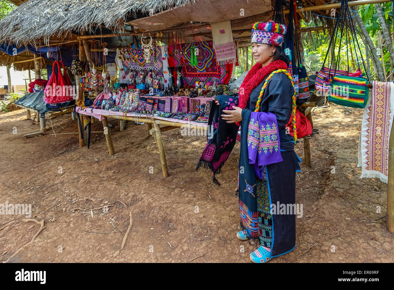 Woman from the Lahu tribe with traditional costume, selling souvenirs ...