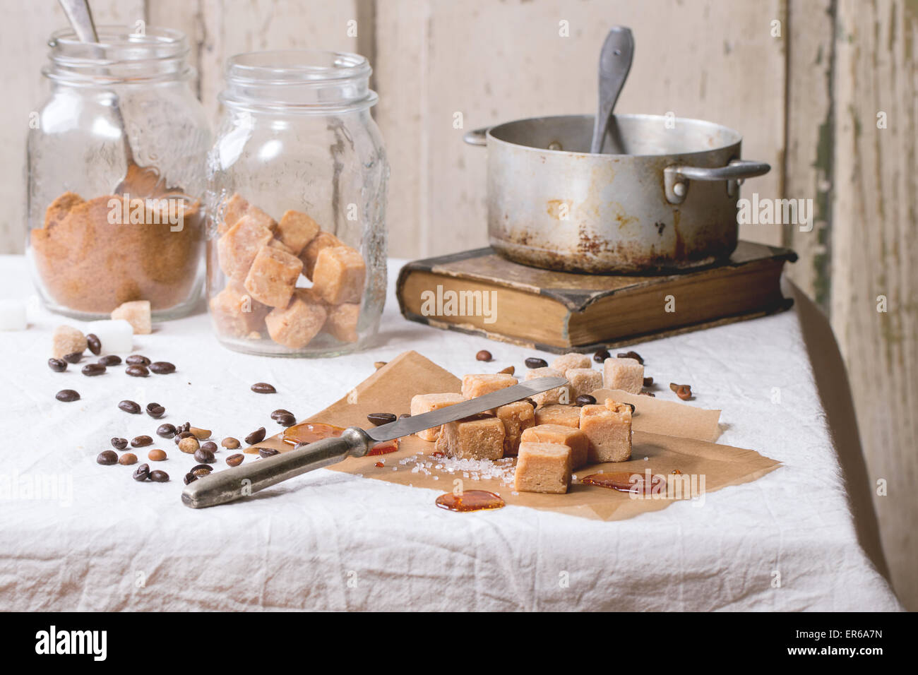 Fudge candy, coffee beans and caramel on baking paper, served over ...