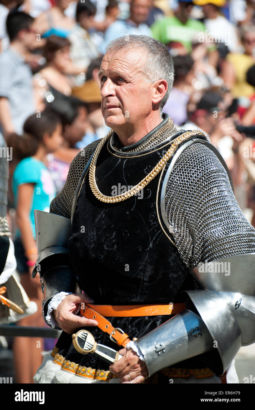 man in medieval armor of Contrada della Lupa at Corteo Storico before ...