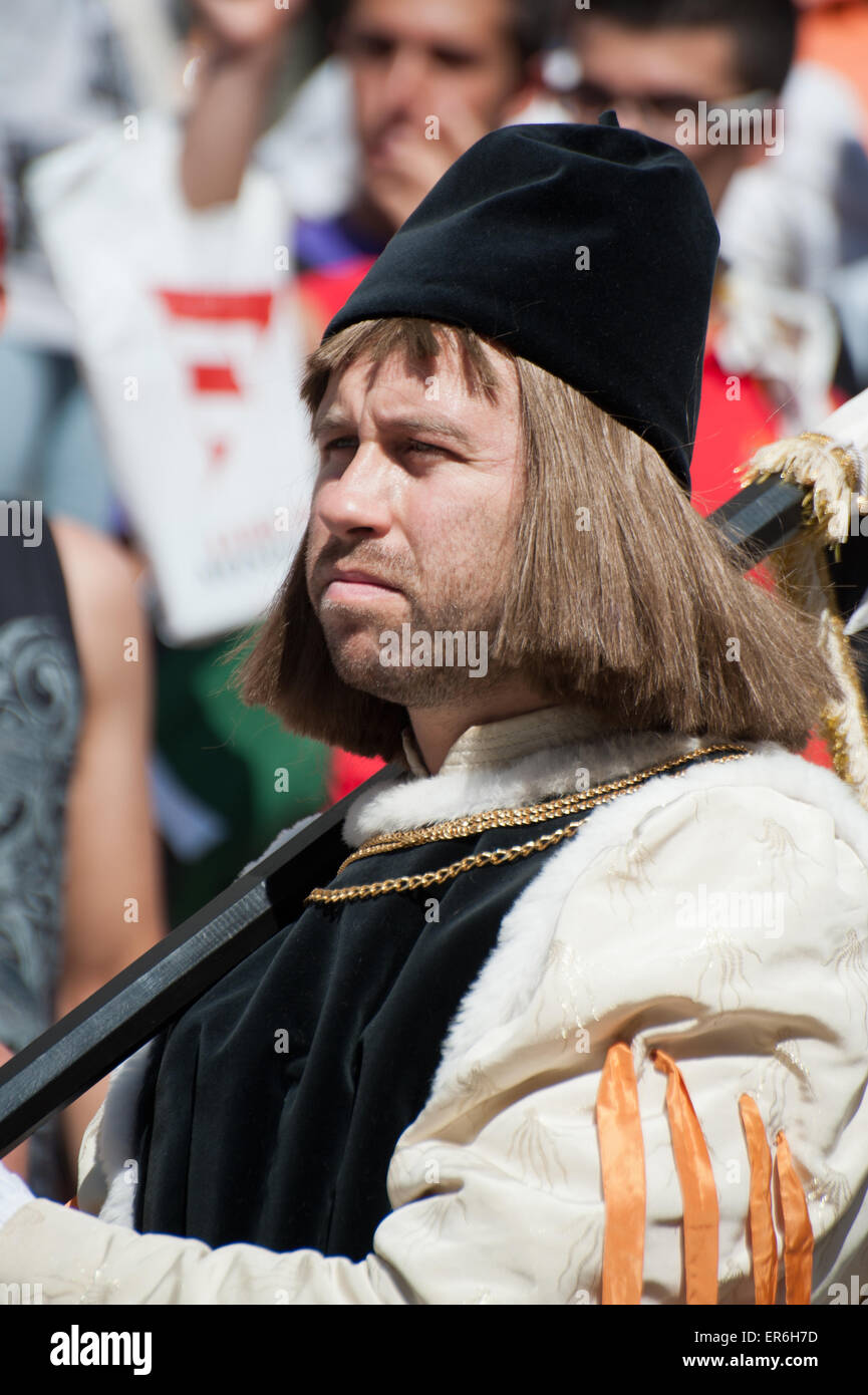 man in medieval costume of Contrada della Lupa at Corteo Storico before ...