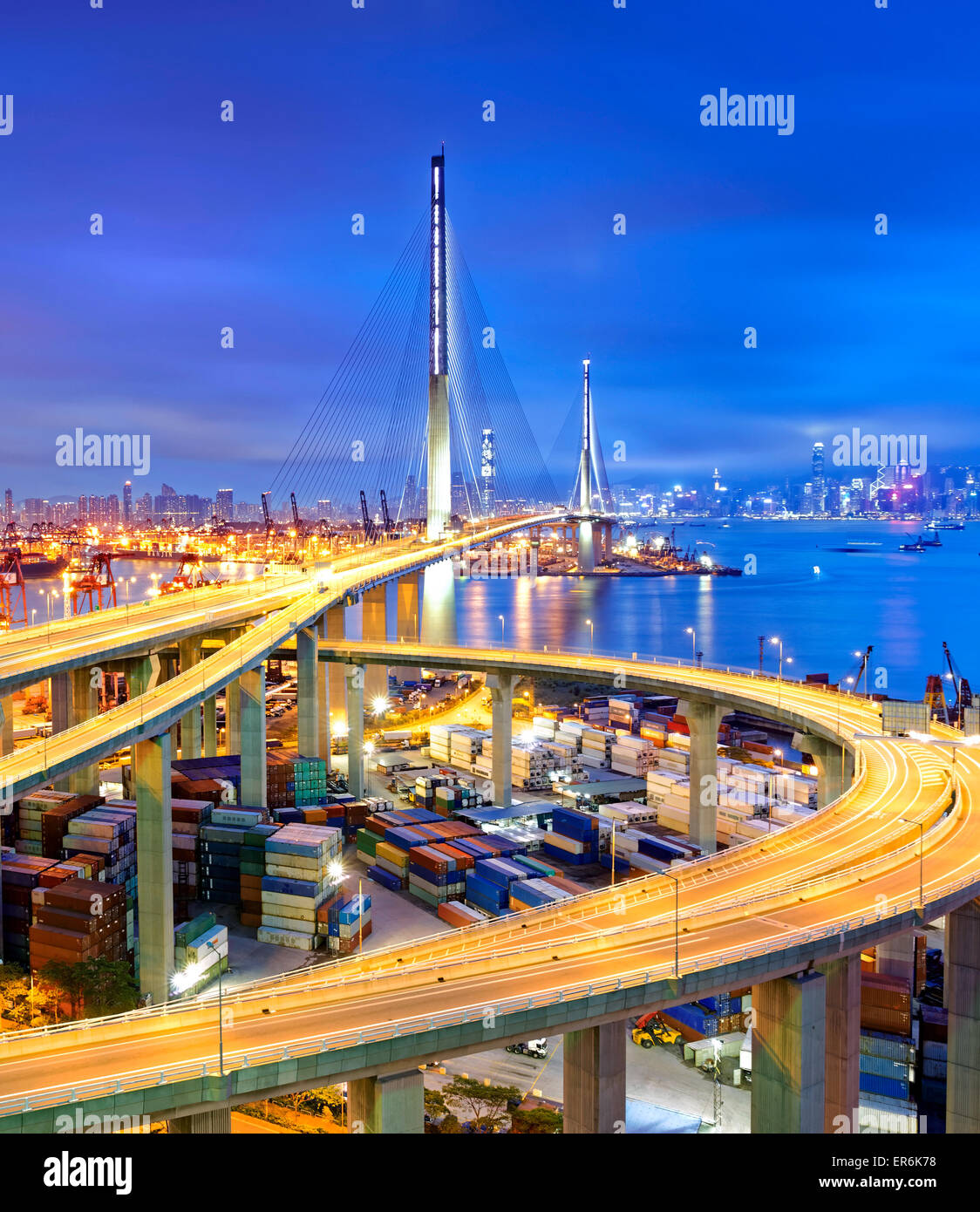 Container Cargo freight ship with working crane bridge in shipyard ...
