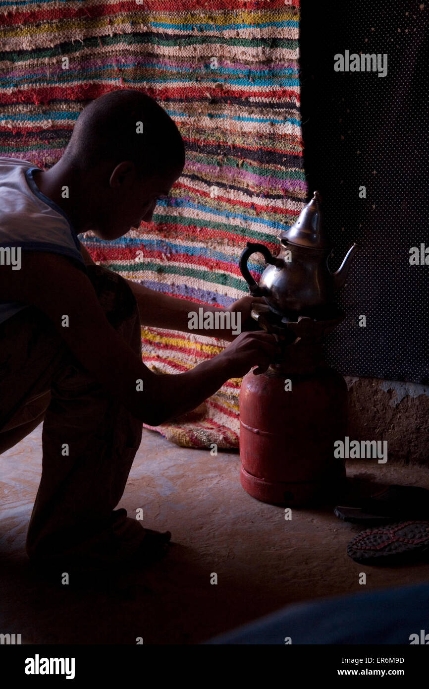 Berber boy makes Moroccan mint tea, M'Hamid, Morocco Stock Photo - Alamy