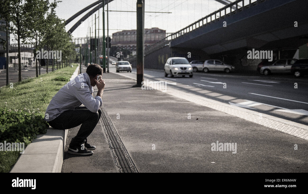 Waiting with a cellphone Stock Photo - Alamy
