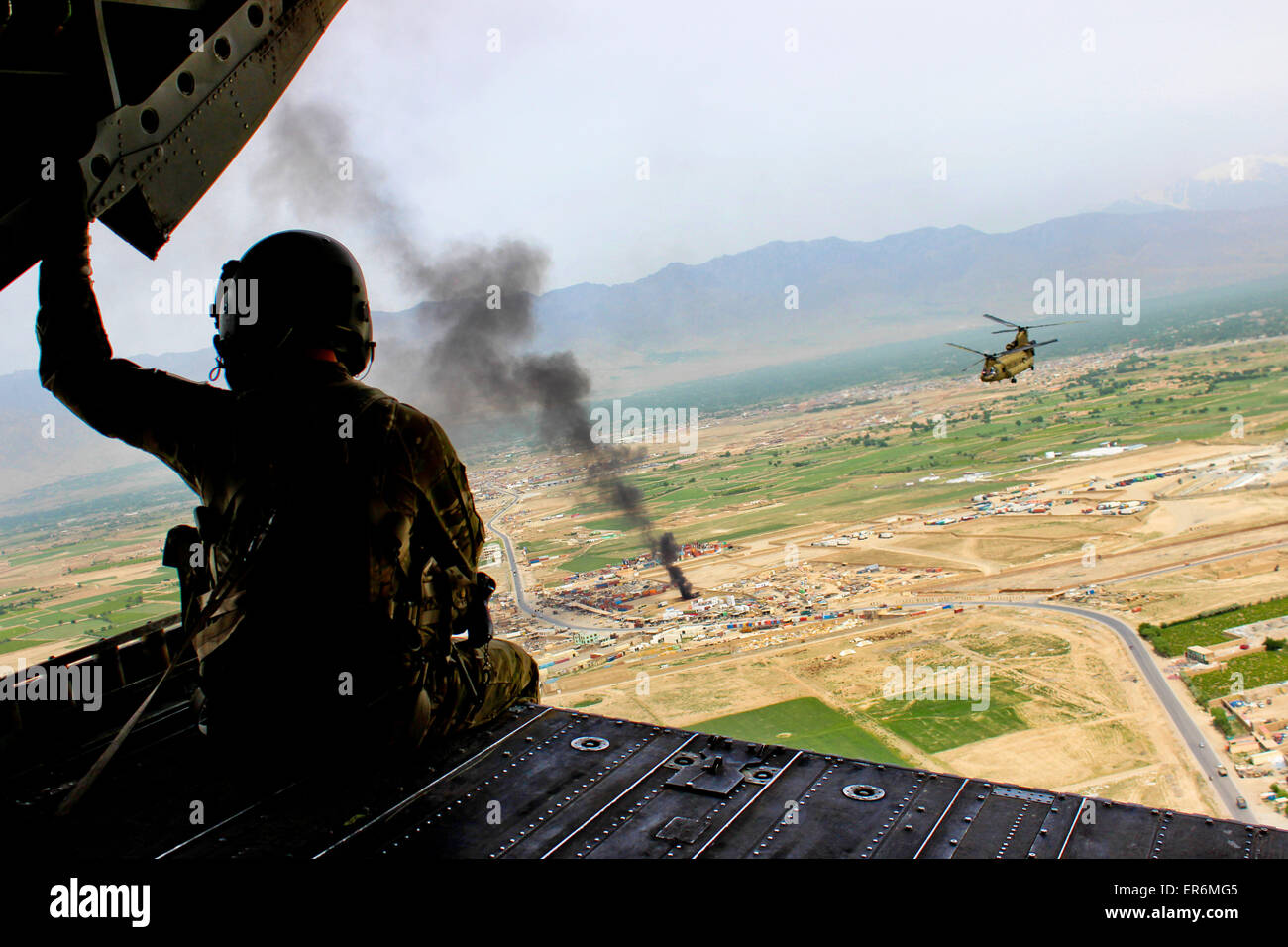 While sitting on the ramp of his ch47 chinook helicopter hi-res stock ...