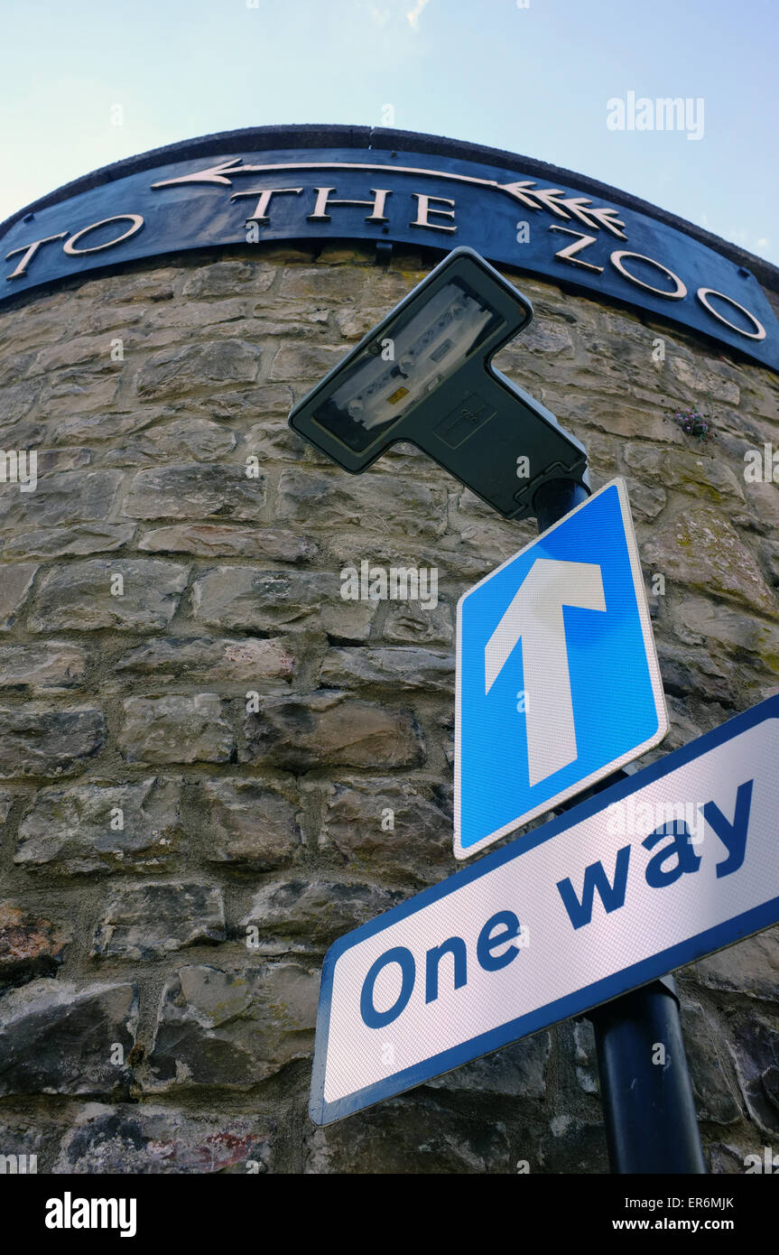 A One Way sign and arrow beneath directions sign to Bristol Zoo Stock ...