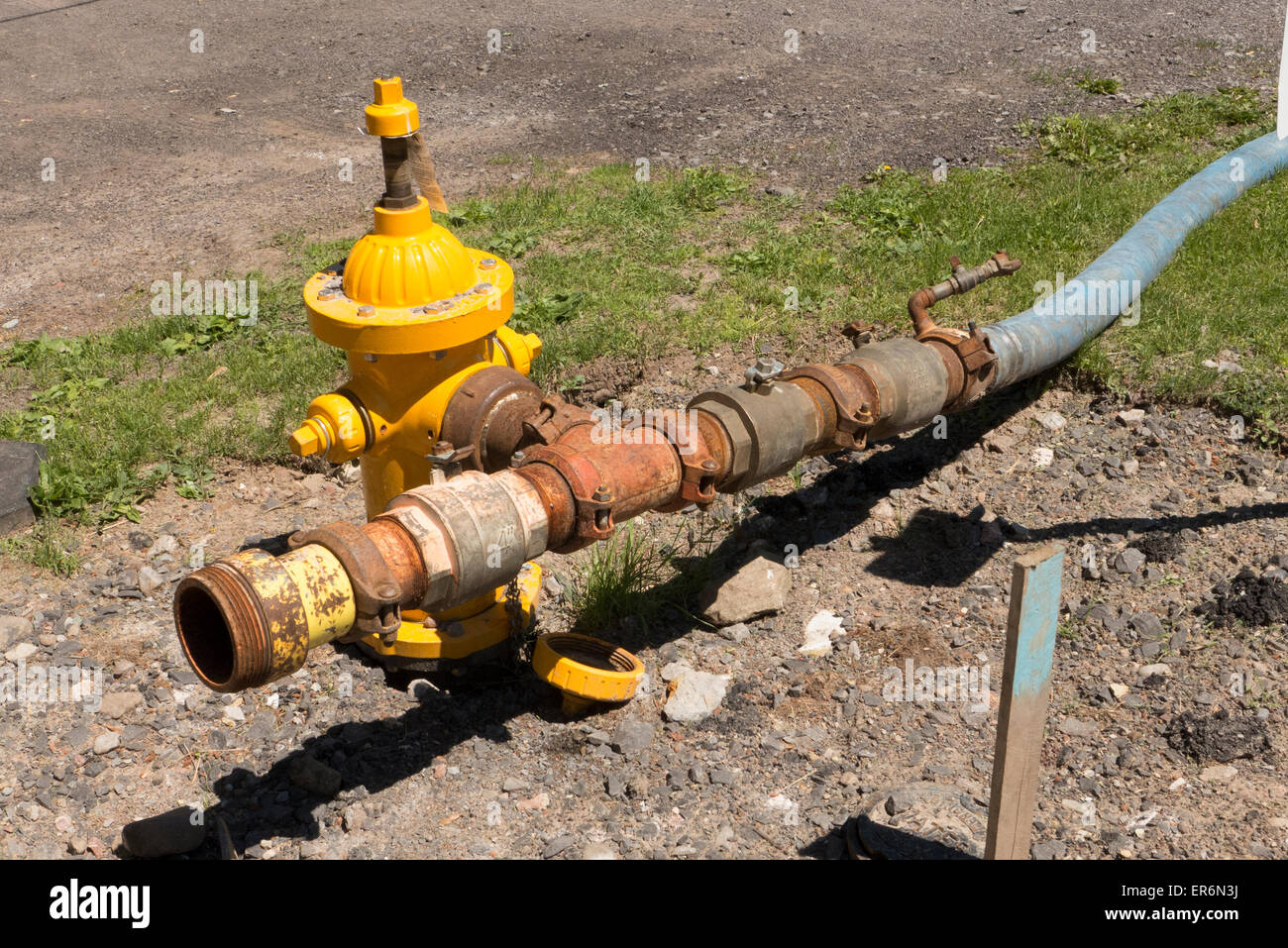 Hose attached to hydrant Stock Photo - Alamy