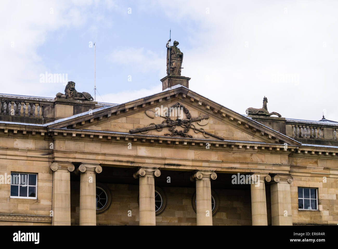 Three statues representing justice on the roofline above the entrance ...