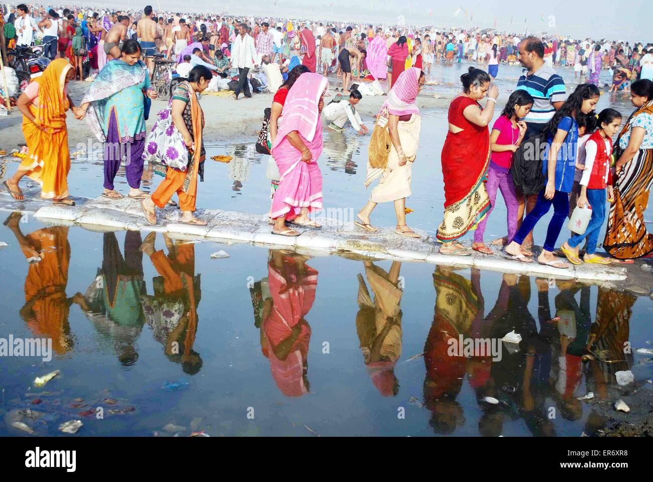 Hindu devotees take holy dip hi-res stock photography and images - Alamy