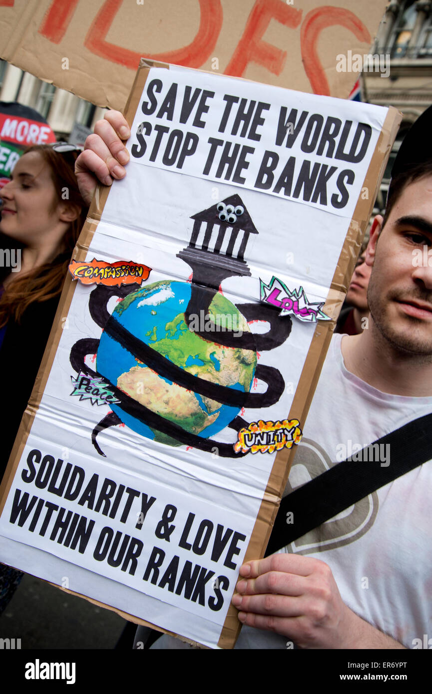 Trafalgar Square. Austerity demo. A protester carries a placard saying ...