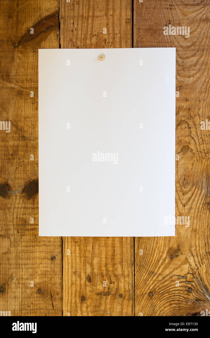 white sheets of paper attached to wooden wall with drawing pins Stock ...