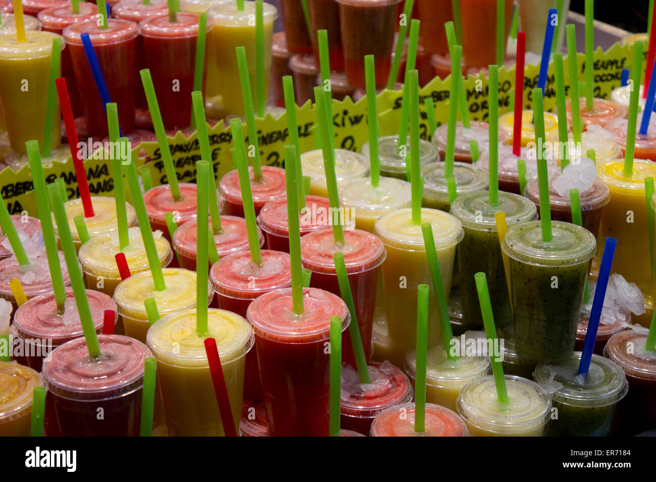 Fresh juices on display at a vendor in a market at La Boqueria ...