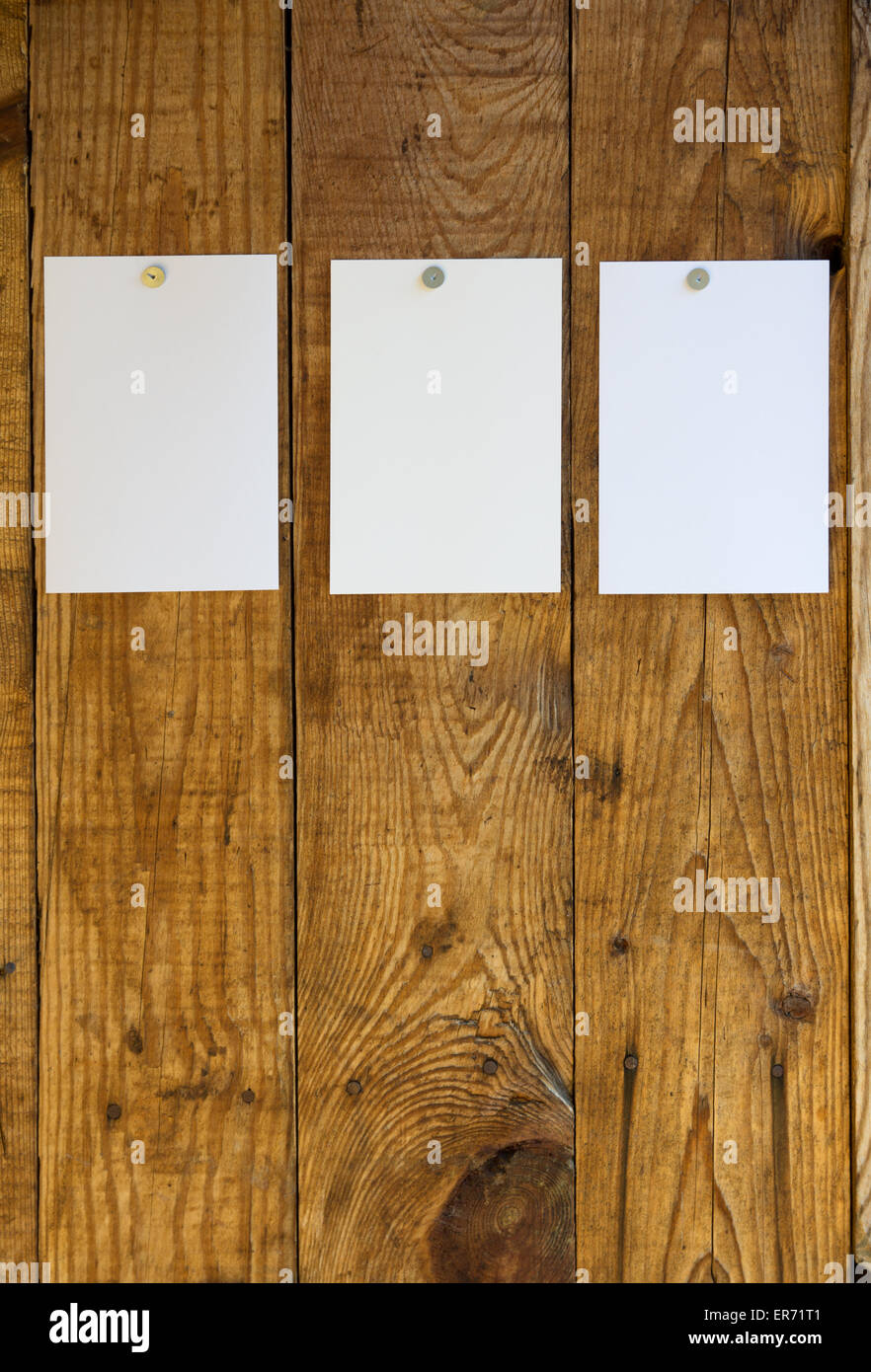 white sheets of paper attached to wooden wall with drawing pins Stock ...