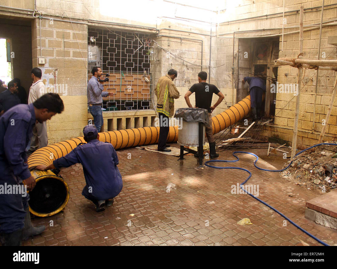 Rescuers are extinguishing fire that erupted at record room of surgical ...