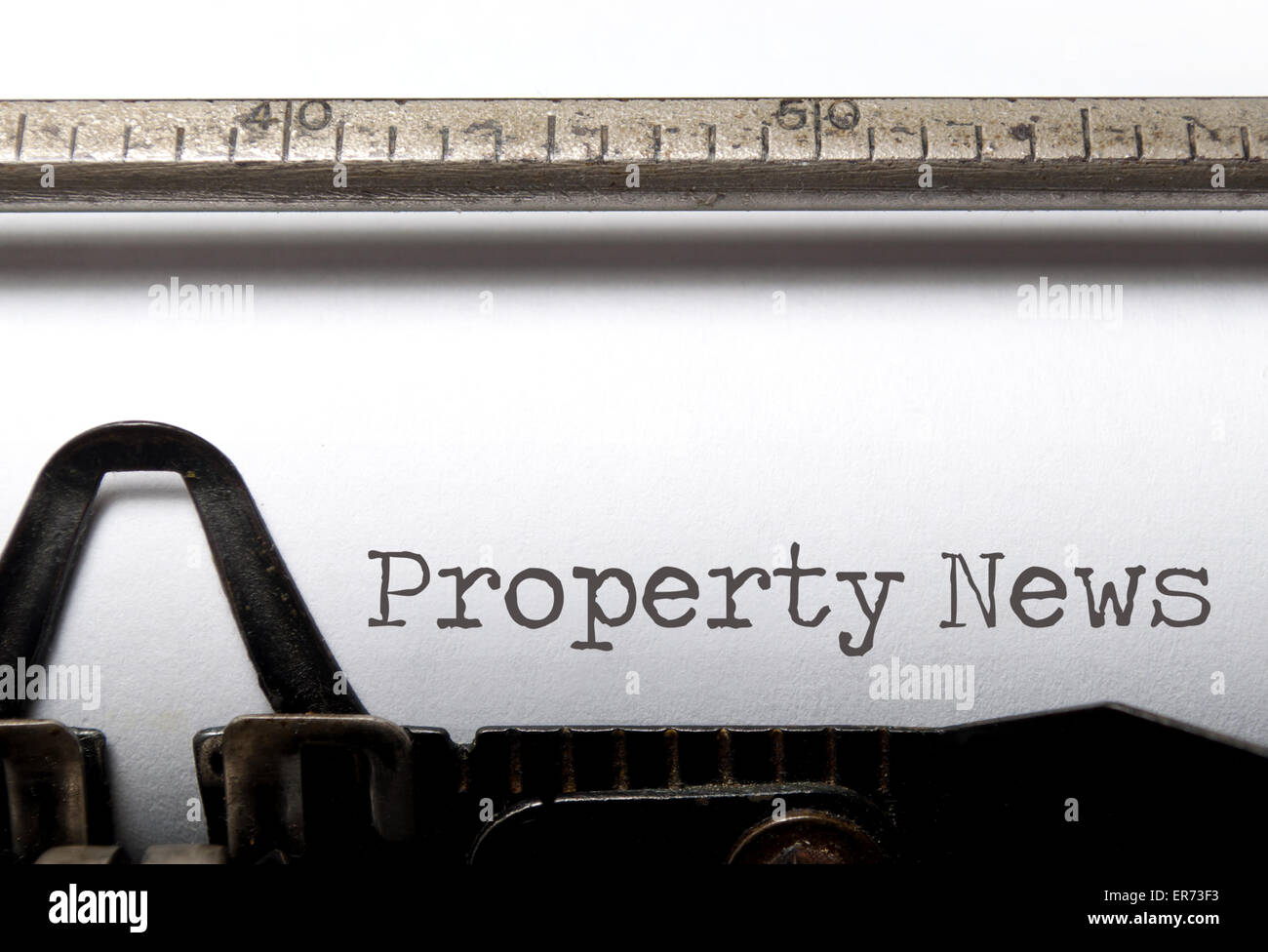 Property news printed on an old typewriter Stock Photo - Alamy