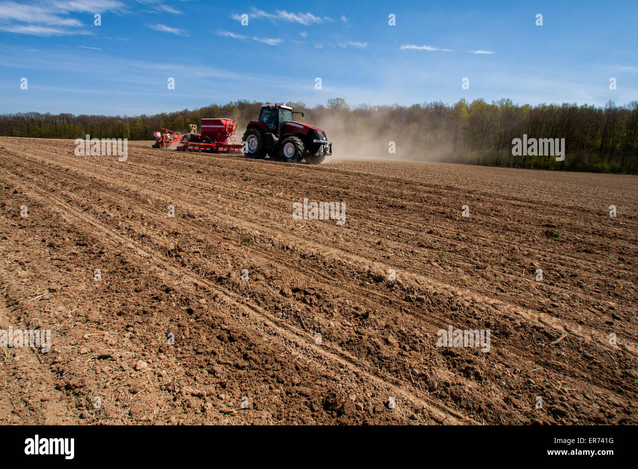 Sowing and plowing action in the spring season Stock Photo - Alamy
