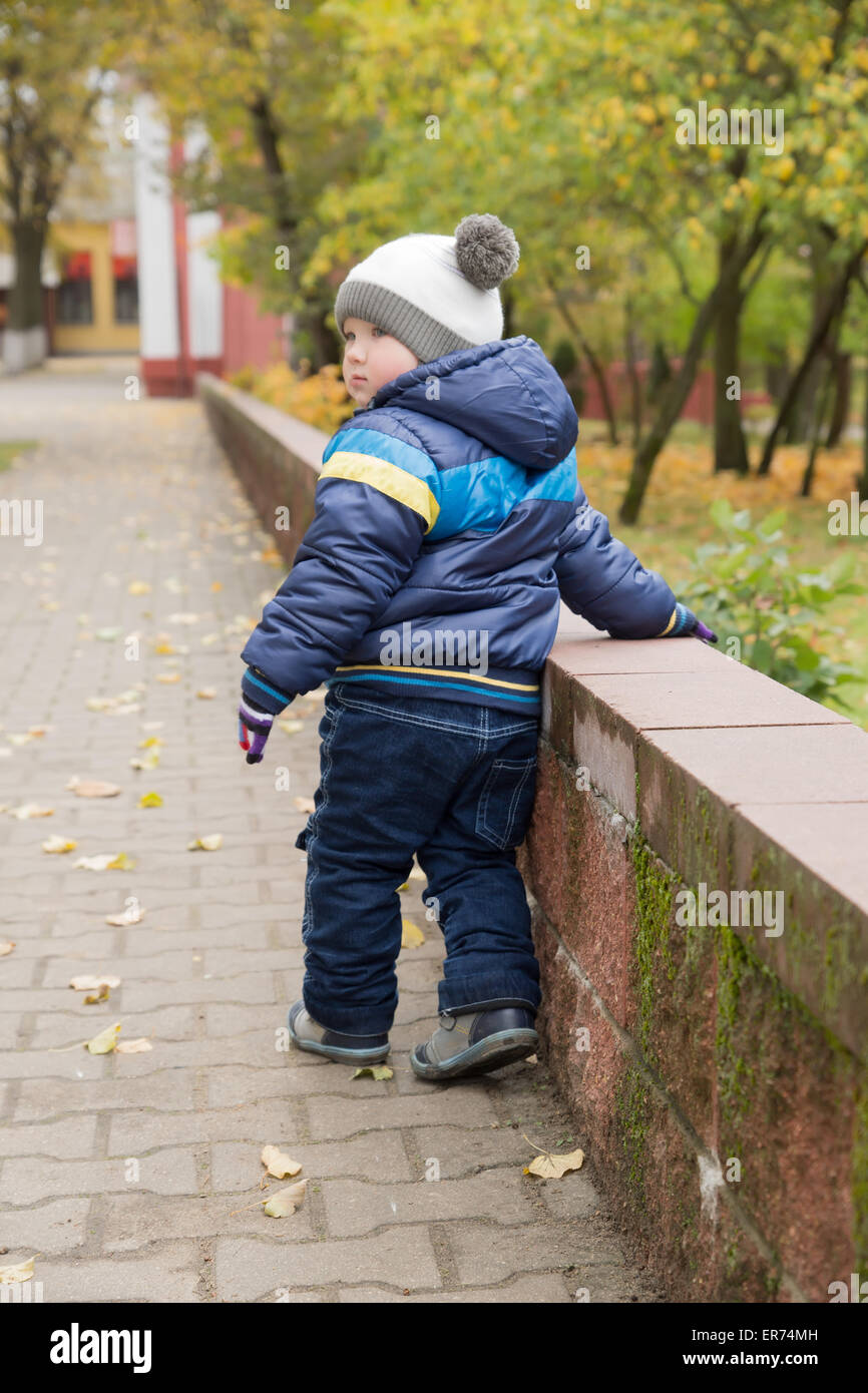 little boy turns around and looks away Stock Photo - Alamy
