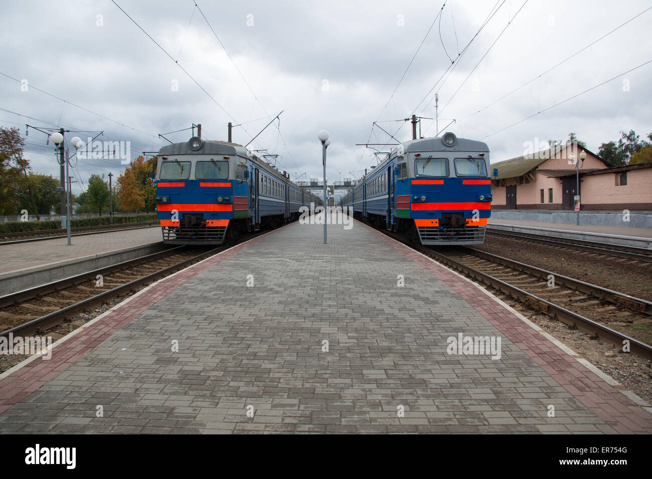 two trains are on the platform waiting for passengers Stock Photo - Alamy