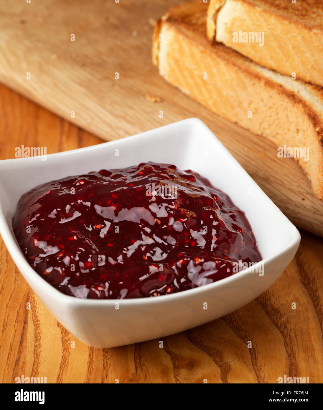 Jam with toast in background Stock Photo - Alamy