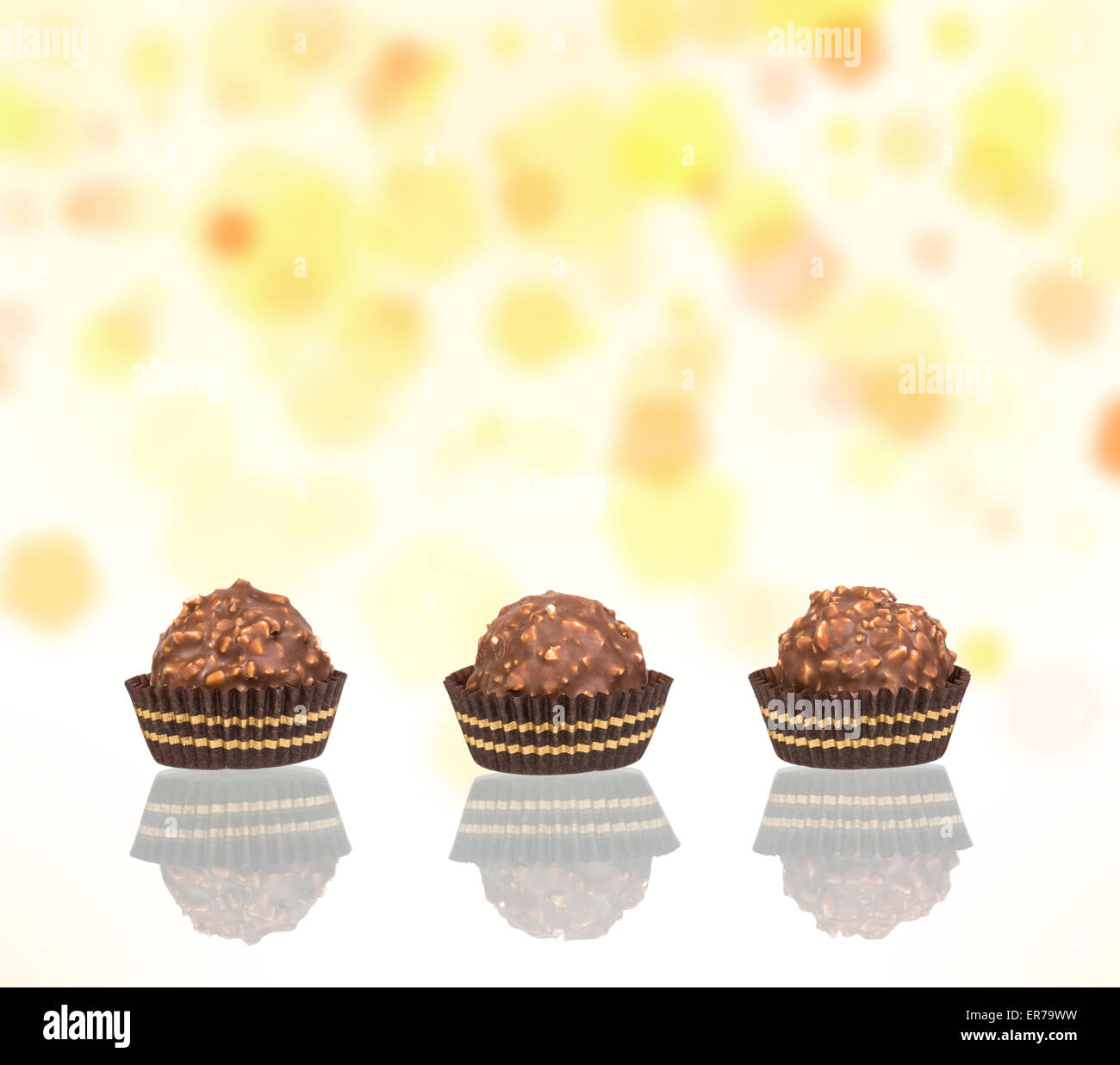 chocolate candy in tartlet form on colorful background Stock Photo - Alamy