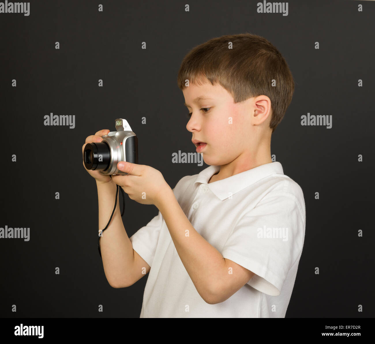 boy with camera on black background Stock Photo - Alamy