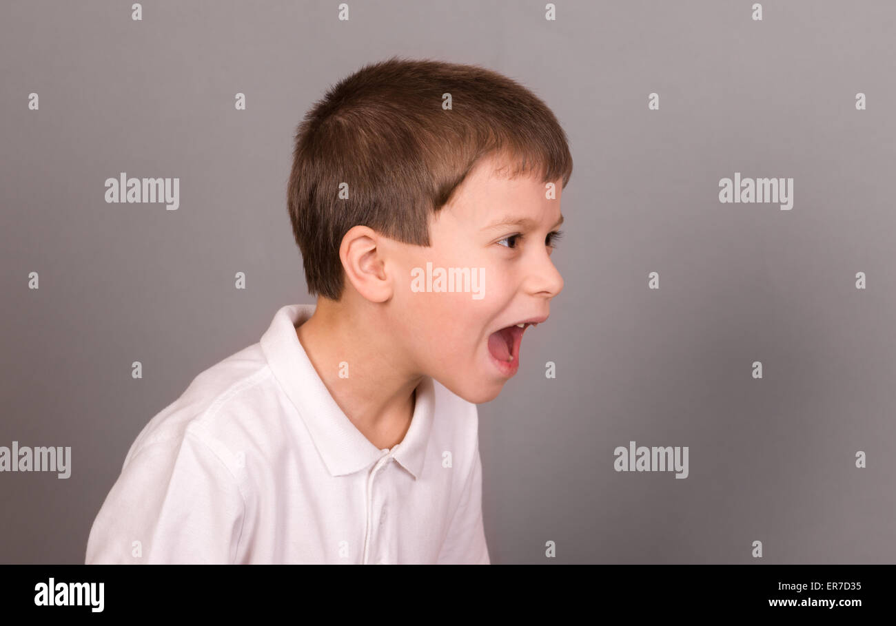 sad boy on grey Stock Photo - Alamy