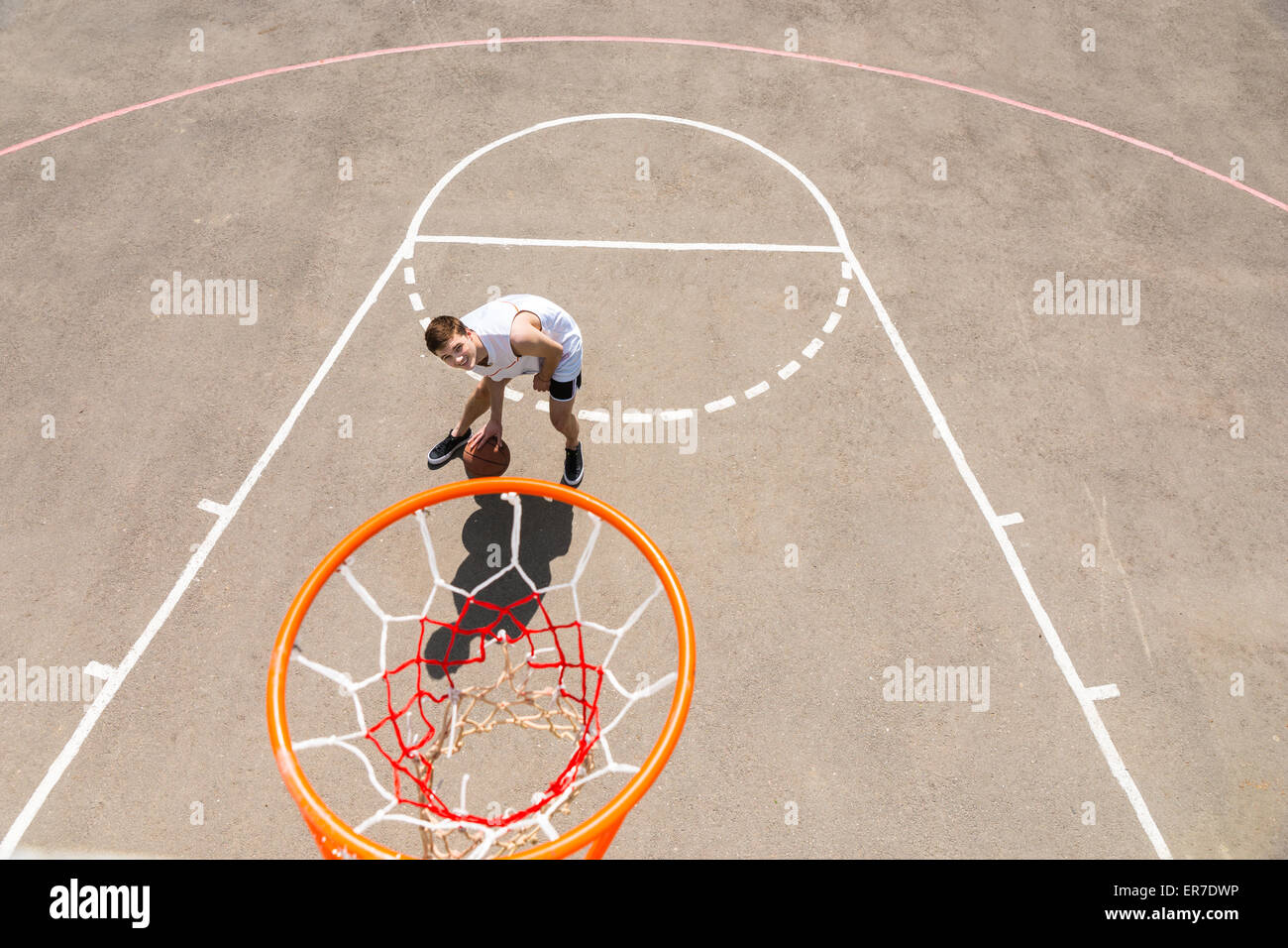 High Angle View from Backboard of Young Athletic Man Dribbling Ball on ...