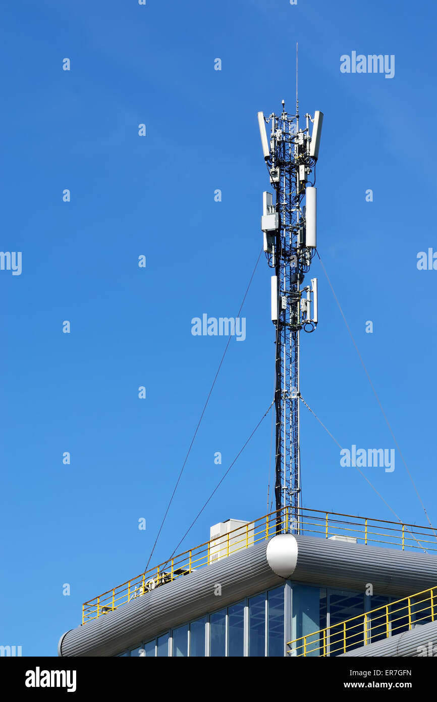 Antenna on the roof of an office building Stock Photo - Alamy