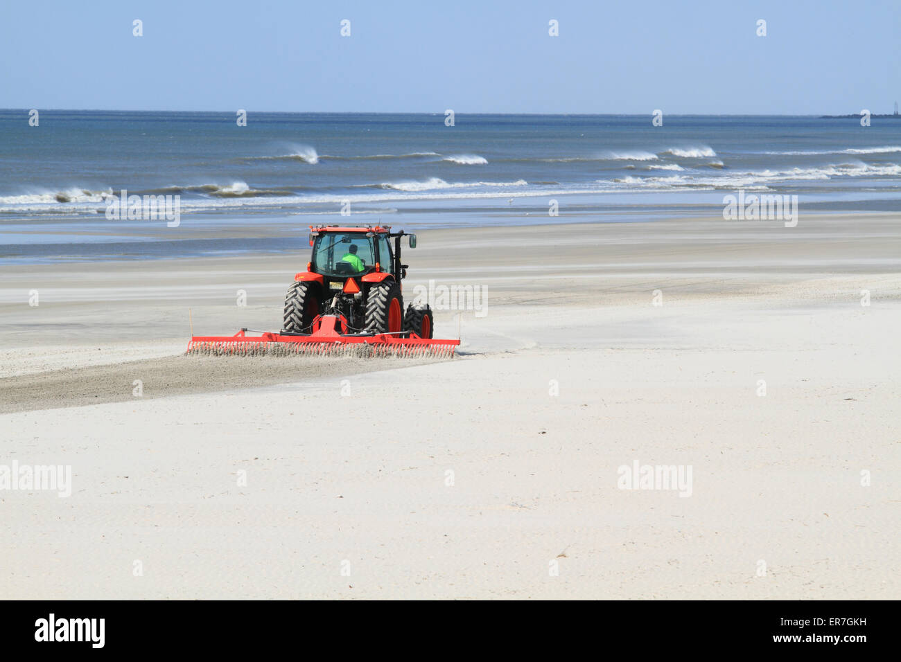 A tractor raking and cleaning the beach in Wildwood Crest, New Jersey ...