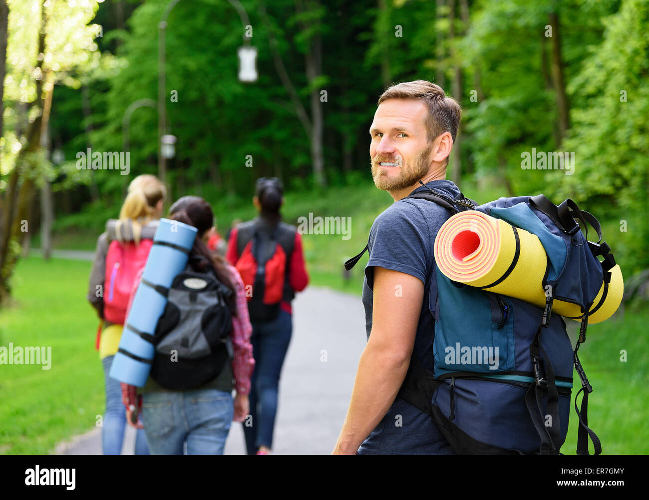 Hikers in forest Stock Photo - Alamy