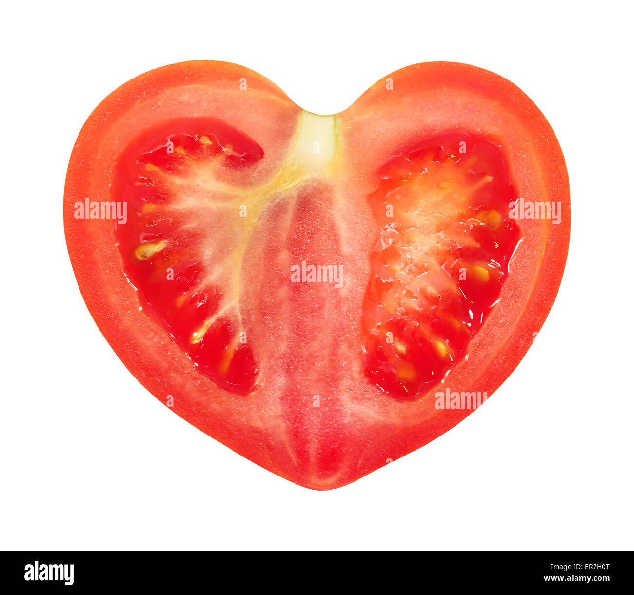 Red tomato in a cut is photographed close-up on a white background ...