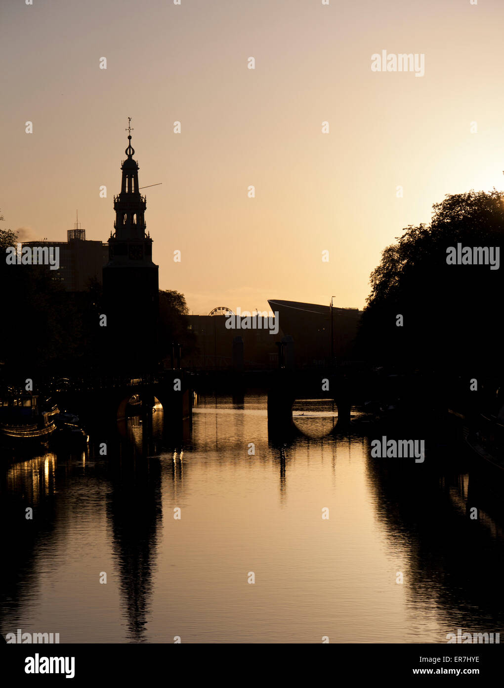 Montelbaanstoren silhouetted in the morning light, Amsterdam The ...
