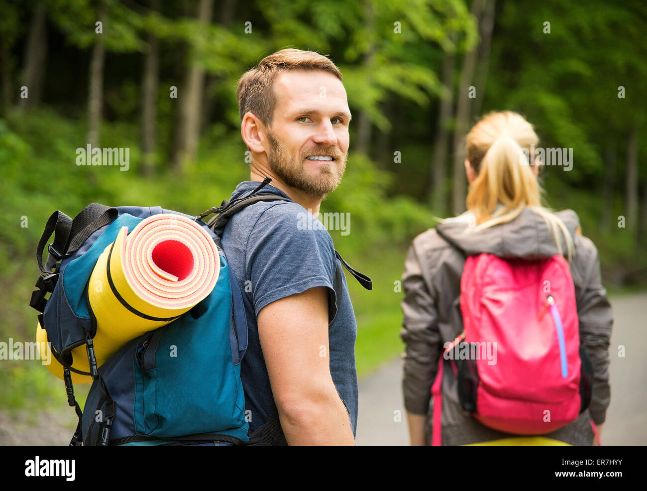 Hikers in forest Stock Photo - Alamy