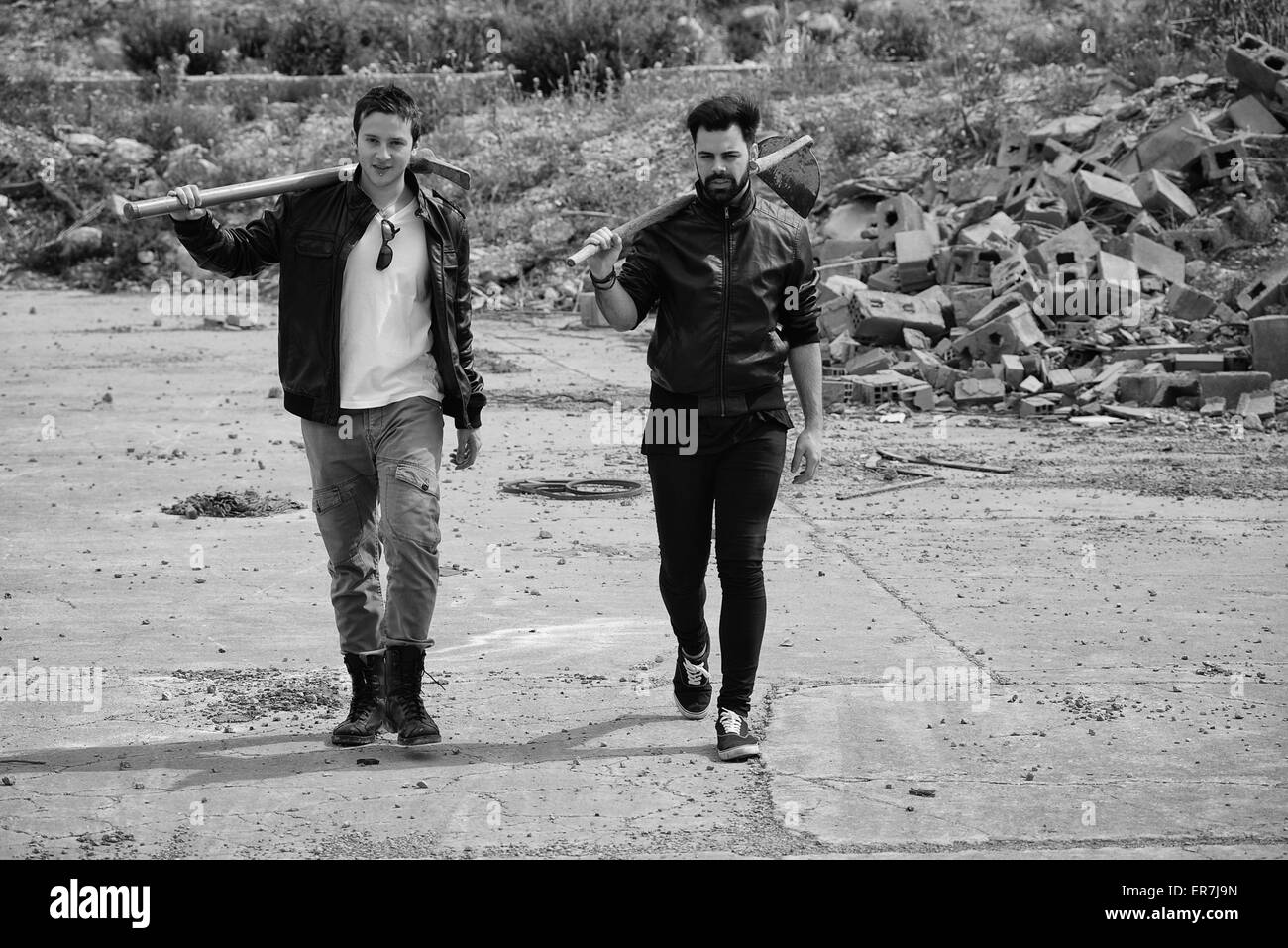 Cool guys walking with pickaxe and shovel Stock Photo - Alamy