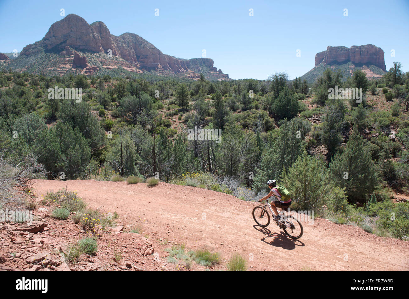 Woman rides the Bell Rock Pathway in South Sedona, Arizona Stock Photo ...