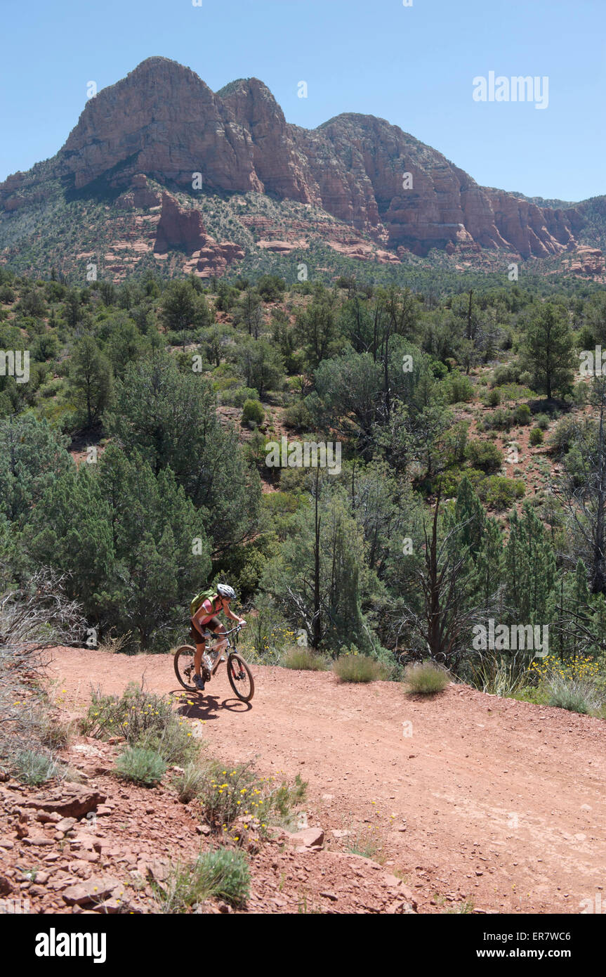 Woman rides the Bell Rock Pathway in South Sedona, Arizona Stock Photo ...