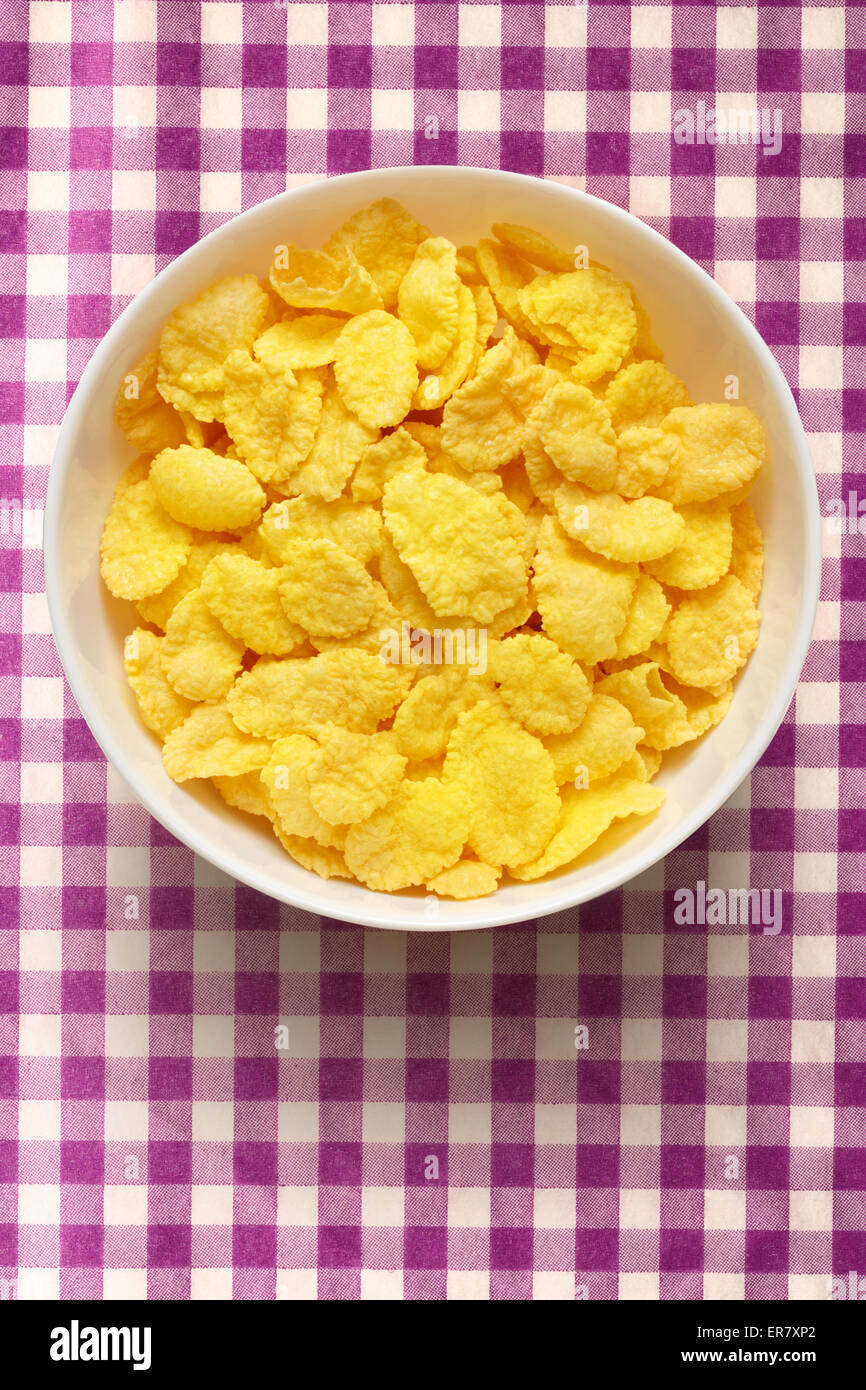 Yellow corn flakes in the white bowl Stock Photo - Alamy
