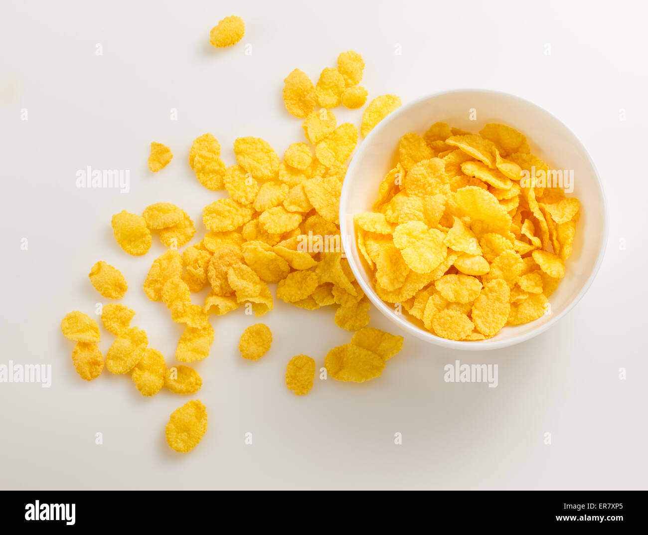 Yellow corn flakes in the white bowl Stock Photo - Alamy