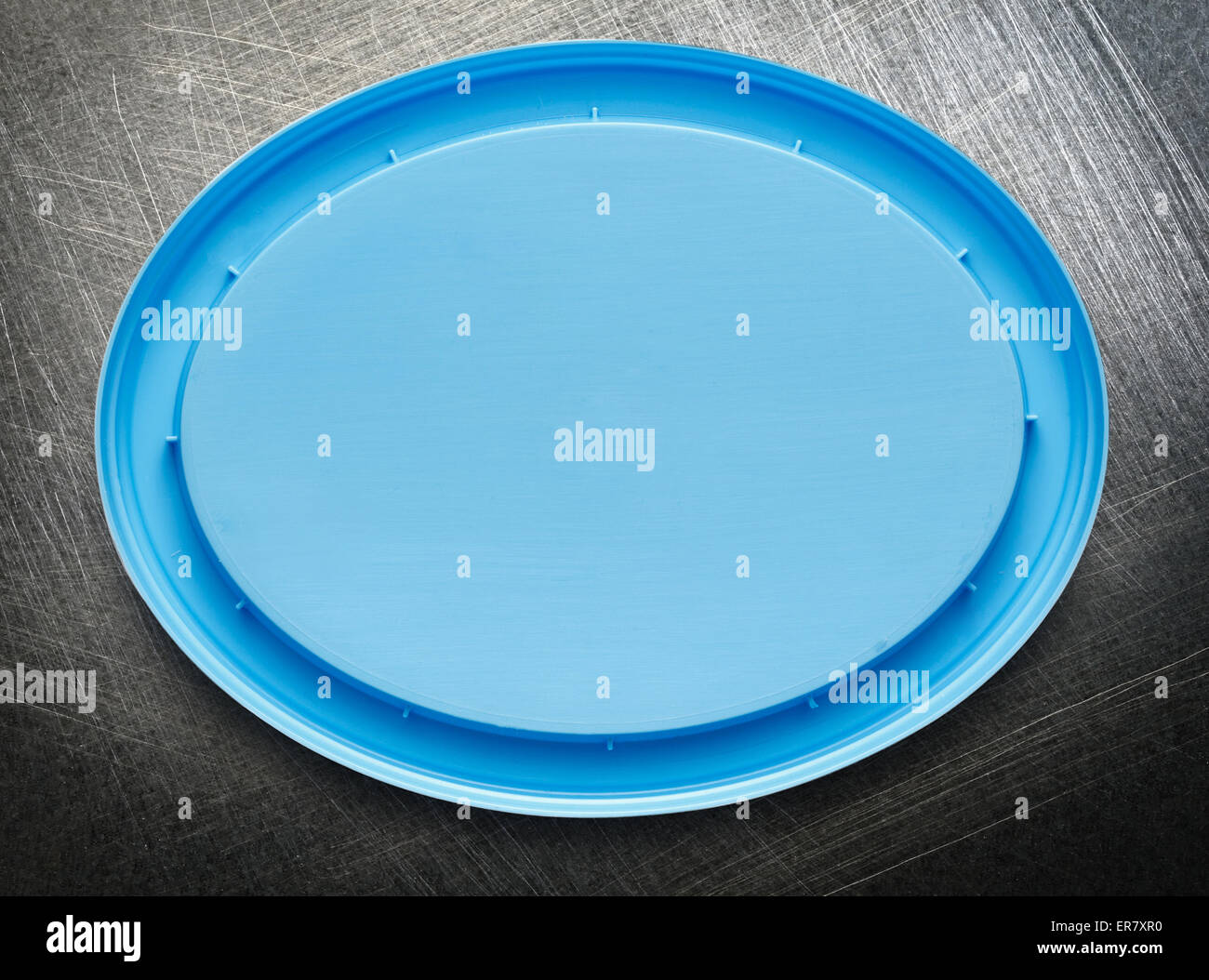 Blue plastic cover on steel background closeup Stock Photo - Alamy