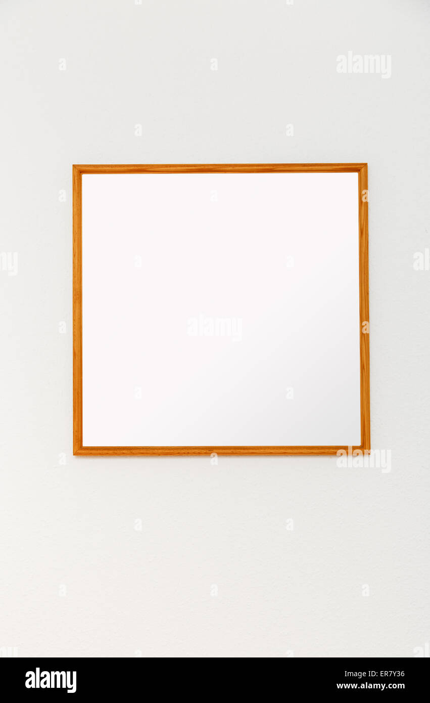 Blank square frame on the white wall Stock Photo - Alamy