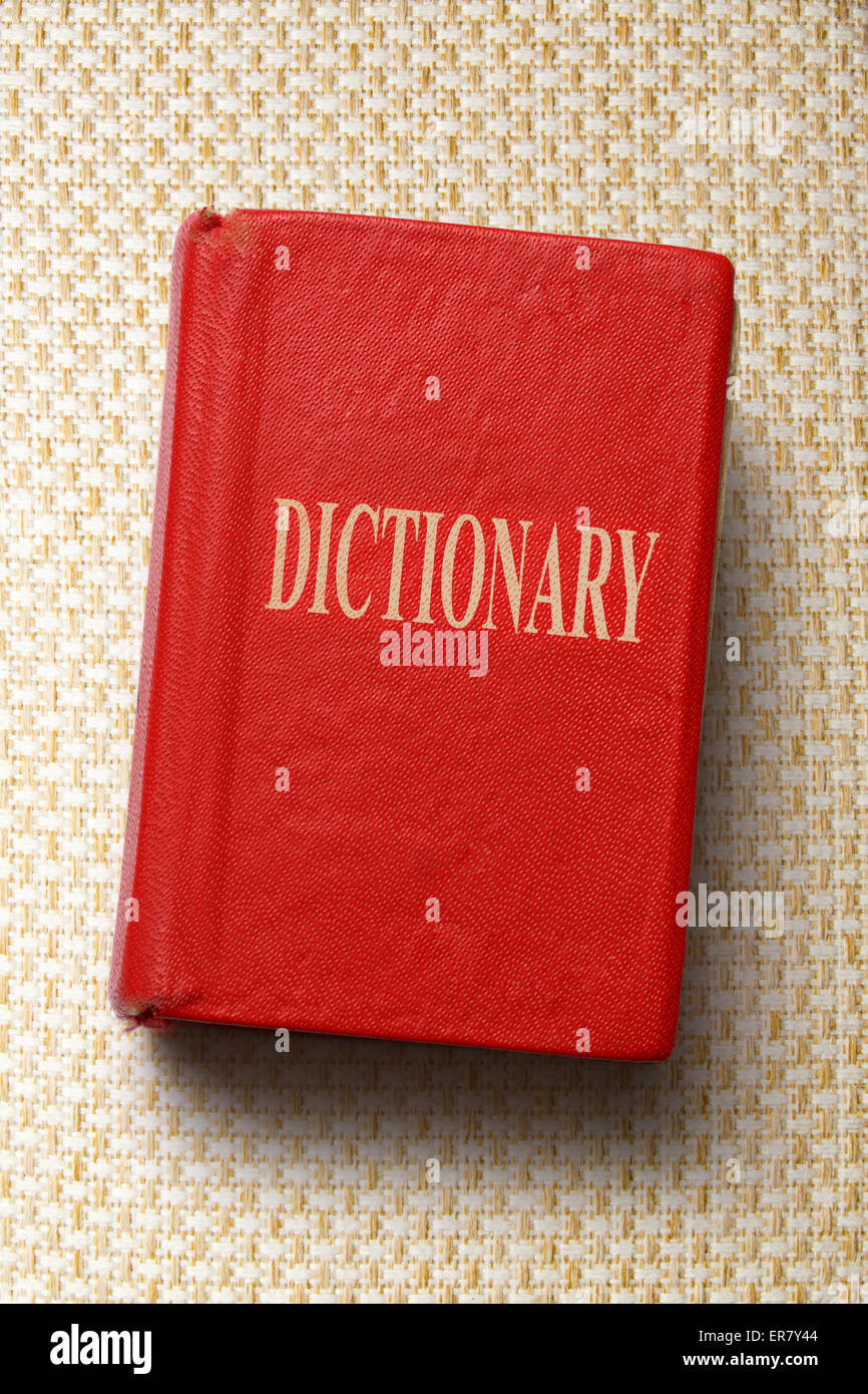 Old red dictionary in closeup on background Stock Photo - Alamy