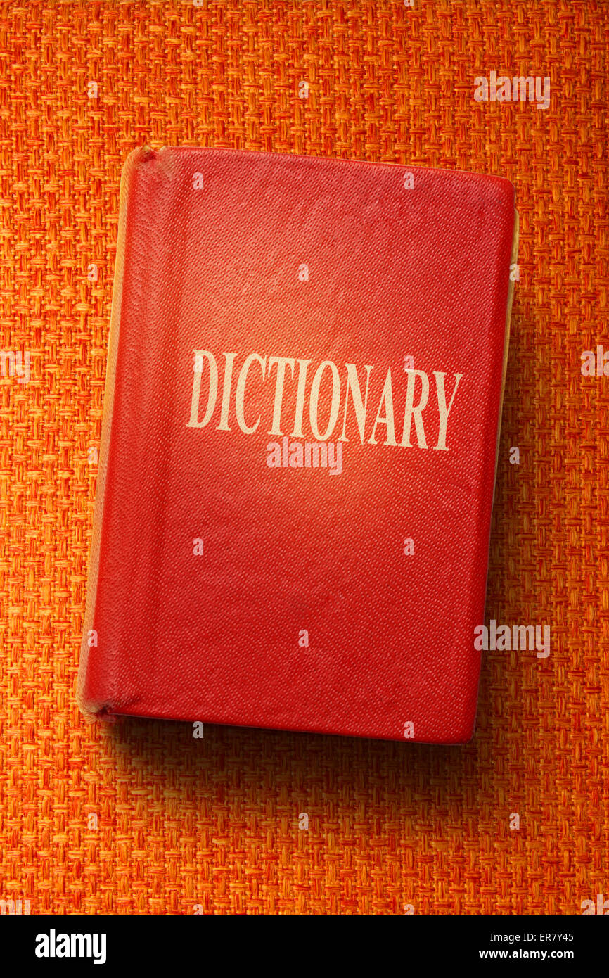 Old red dictionary in closeup on background Stock Photo - Alamy