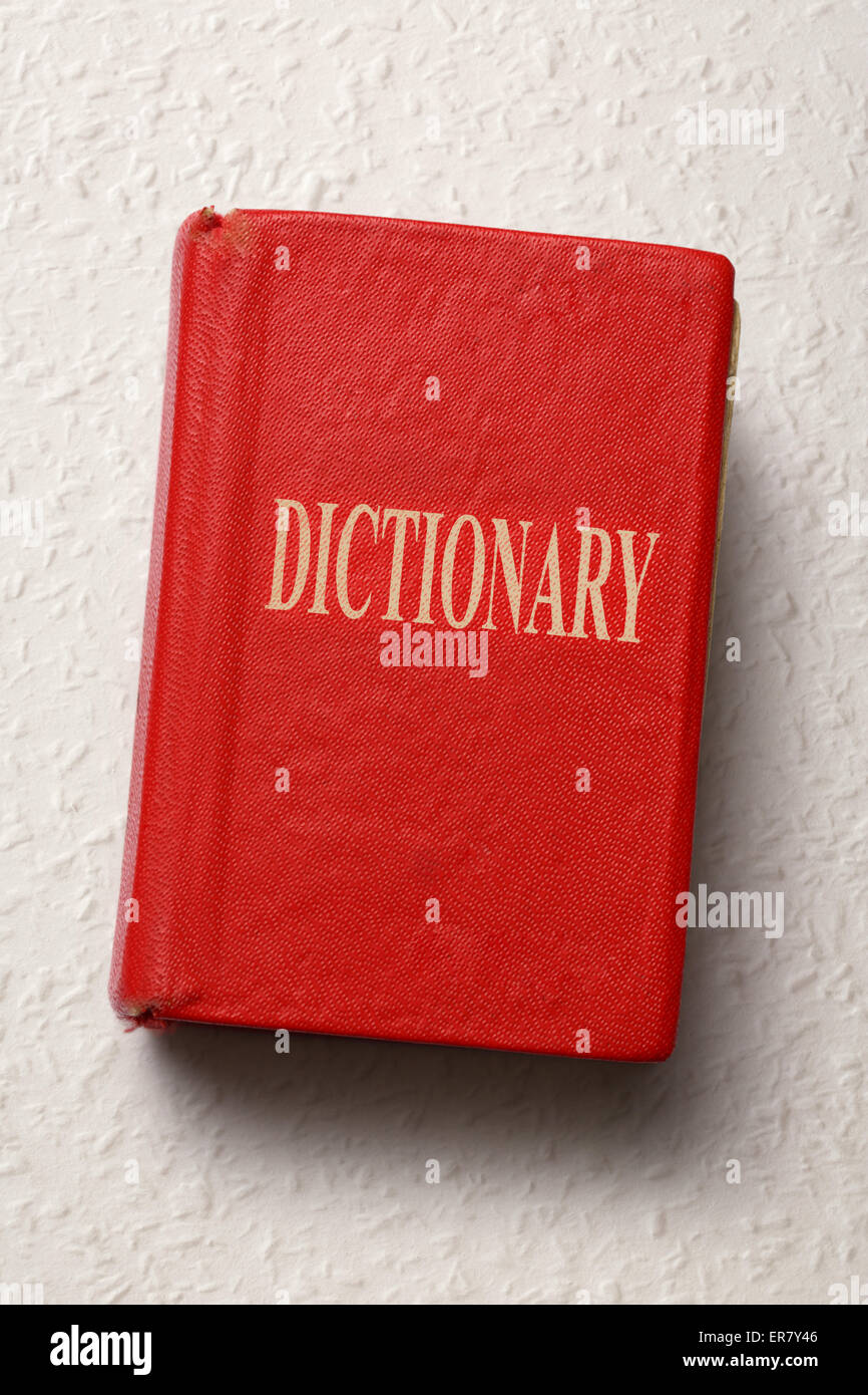 Old red dictionary in closeup on background Stock Photo - Alamy