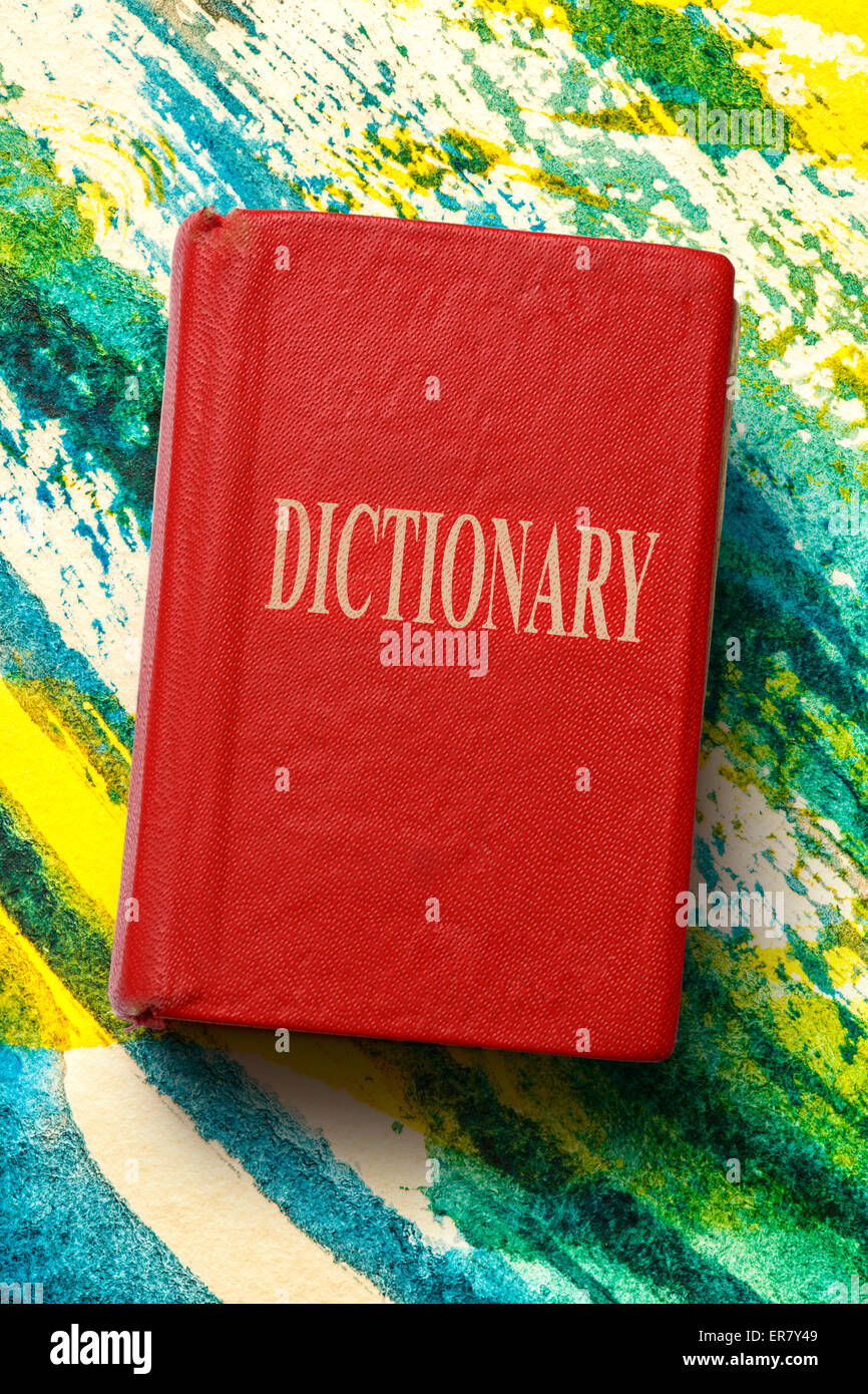 Old red dictionary in closeup on background Stock Photo - Alamy