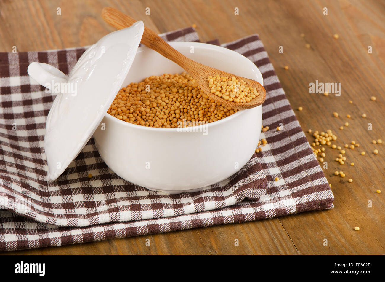 Mustard seeds in bowl . Selective focus Stock Photo - Alamy