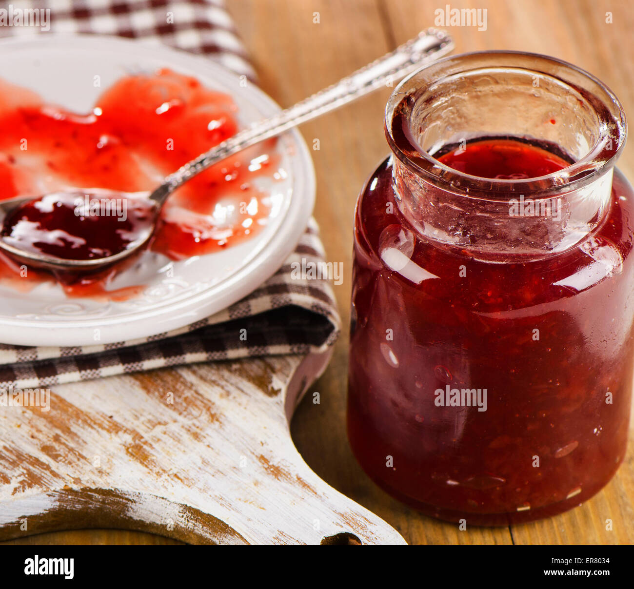 Strawberry jam on a wooden background. Selective focus Stock Photo - Alamy