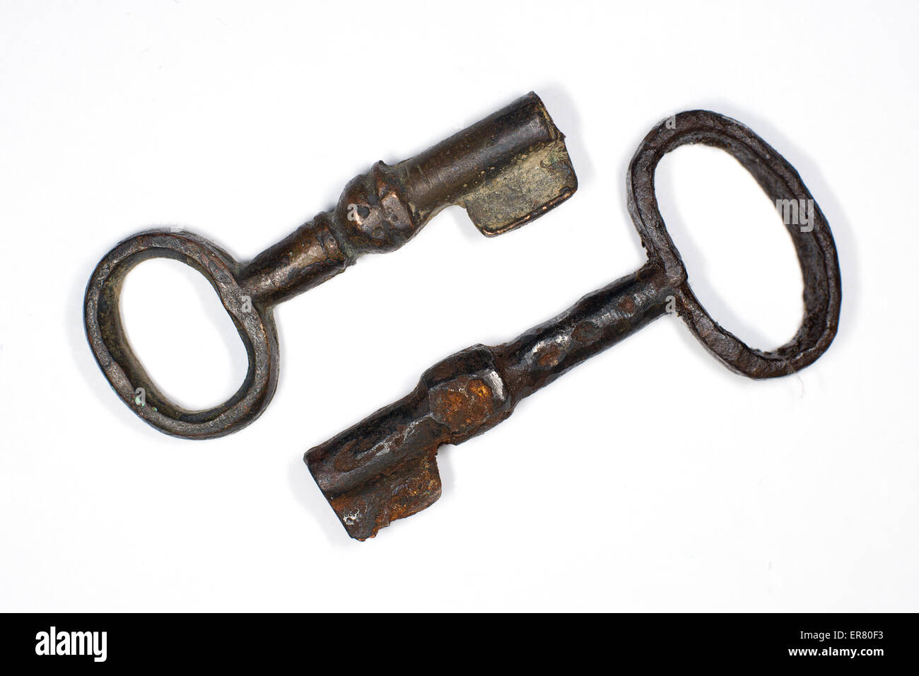 Two vintage keys to the safe on a white background Stock Photo - Alamy